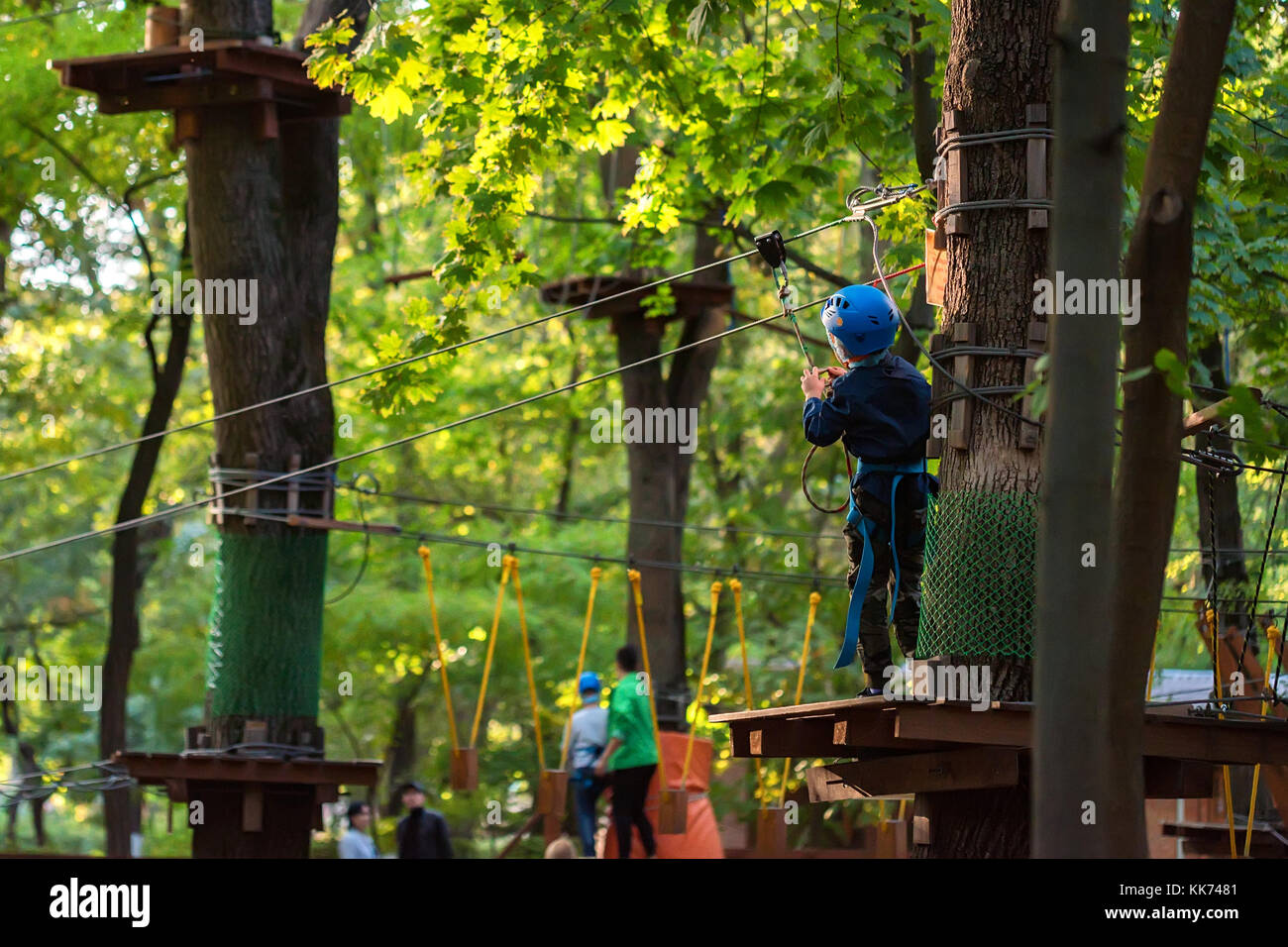 Child on rope course attraction Stock Photo - Alamy