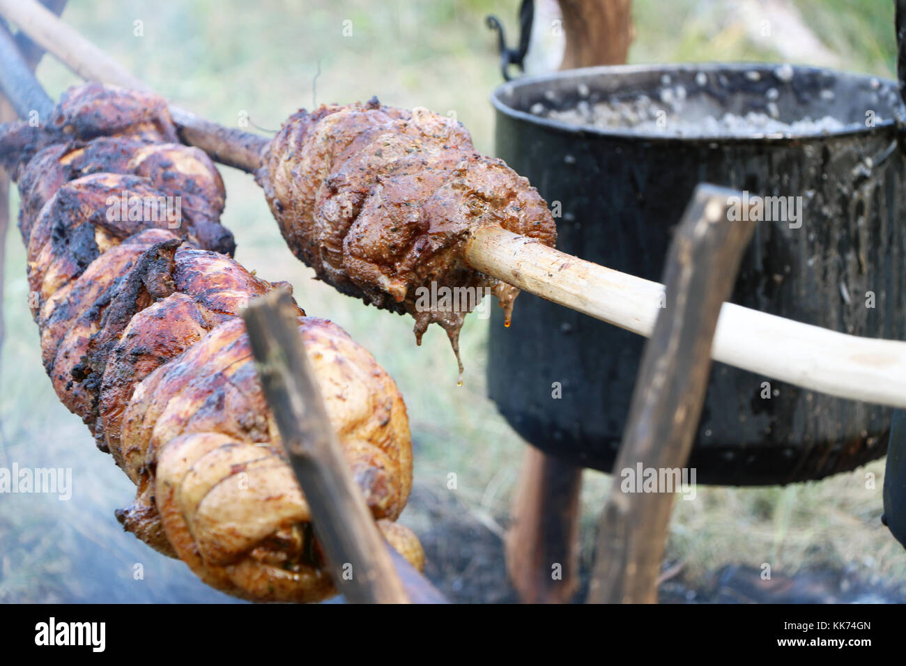 Goth cook meat and porridge on spear over fireplace. Antiquity old food ...