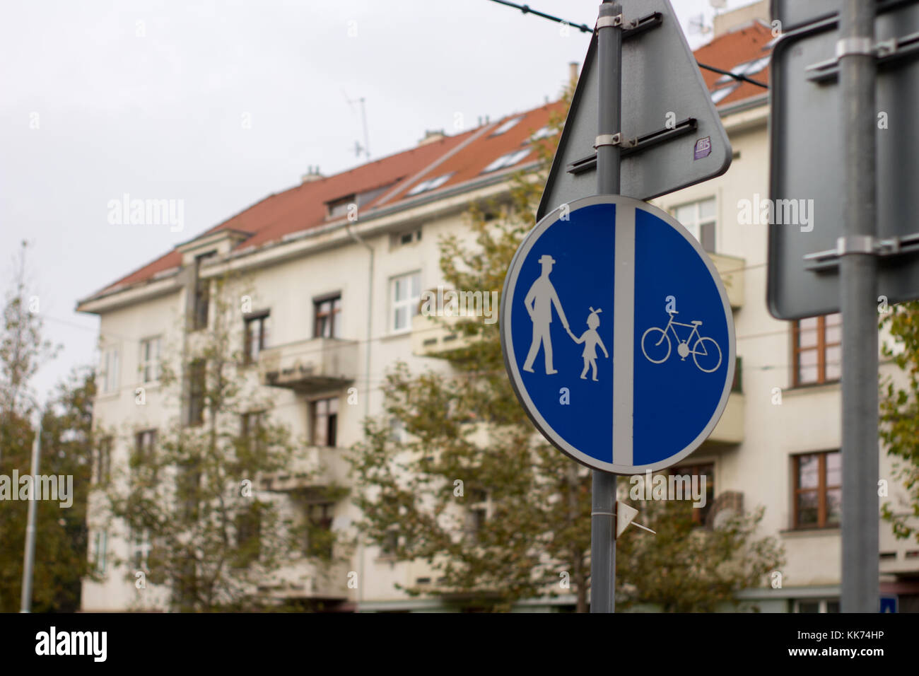 bike and small kid sign on an intersection autumn scenery blue circle ...