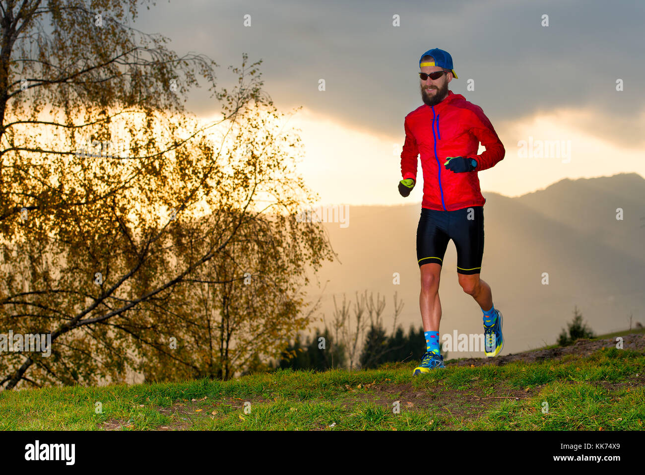 Male jogger running in mountains hi-res stock photography and images ...
