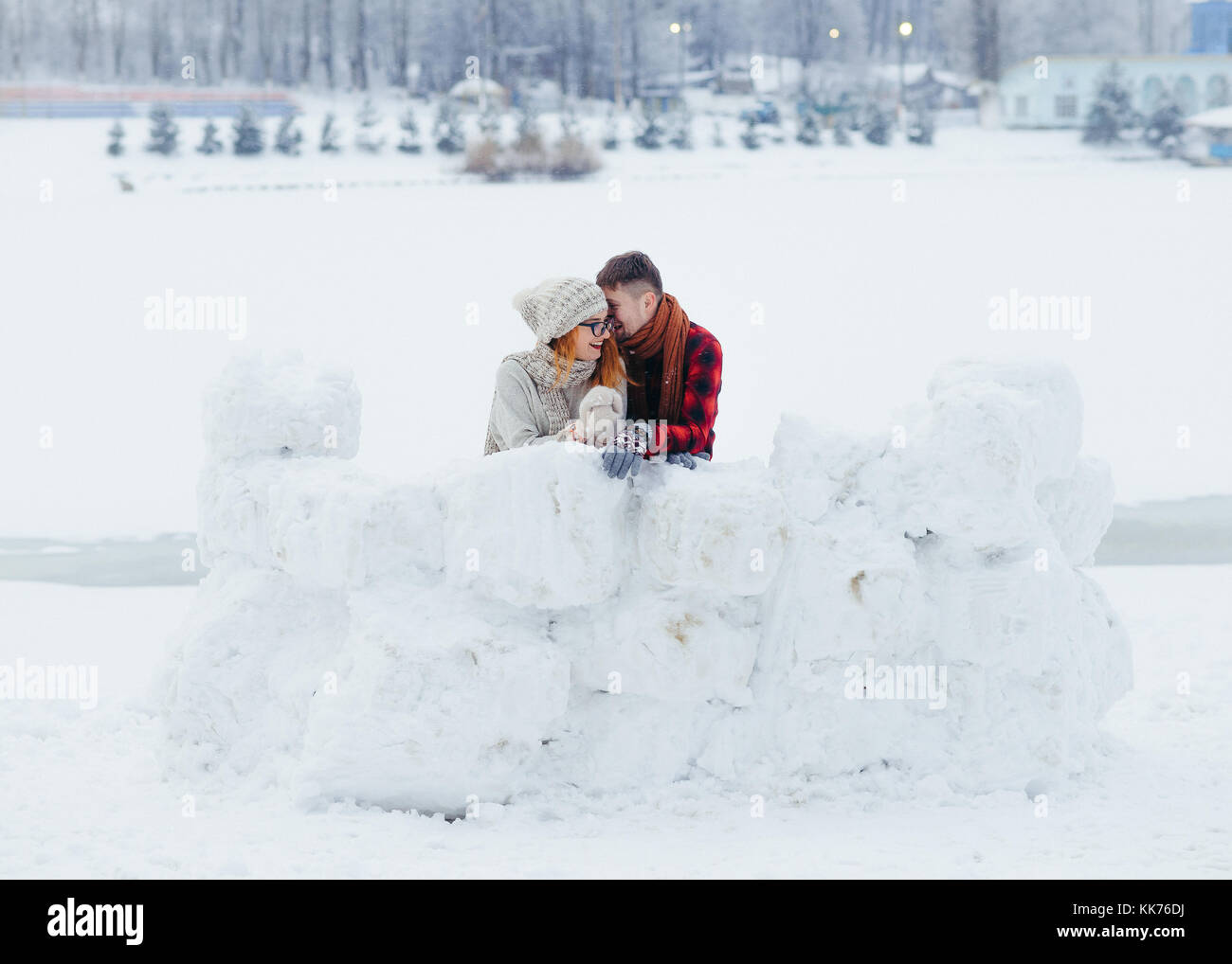 Sensitive full-length portrait of the cheerful laughing couple building ...
