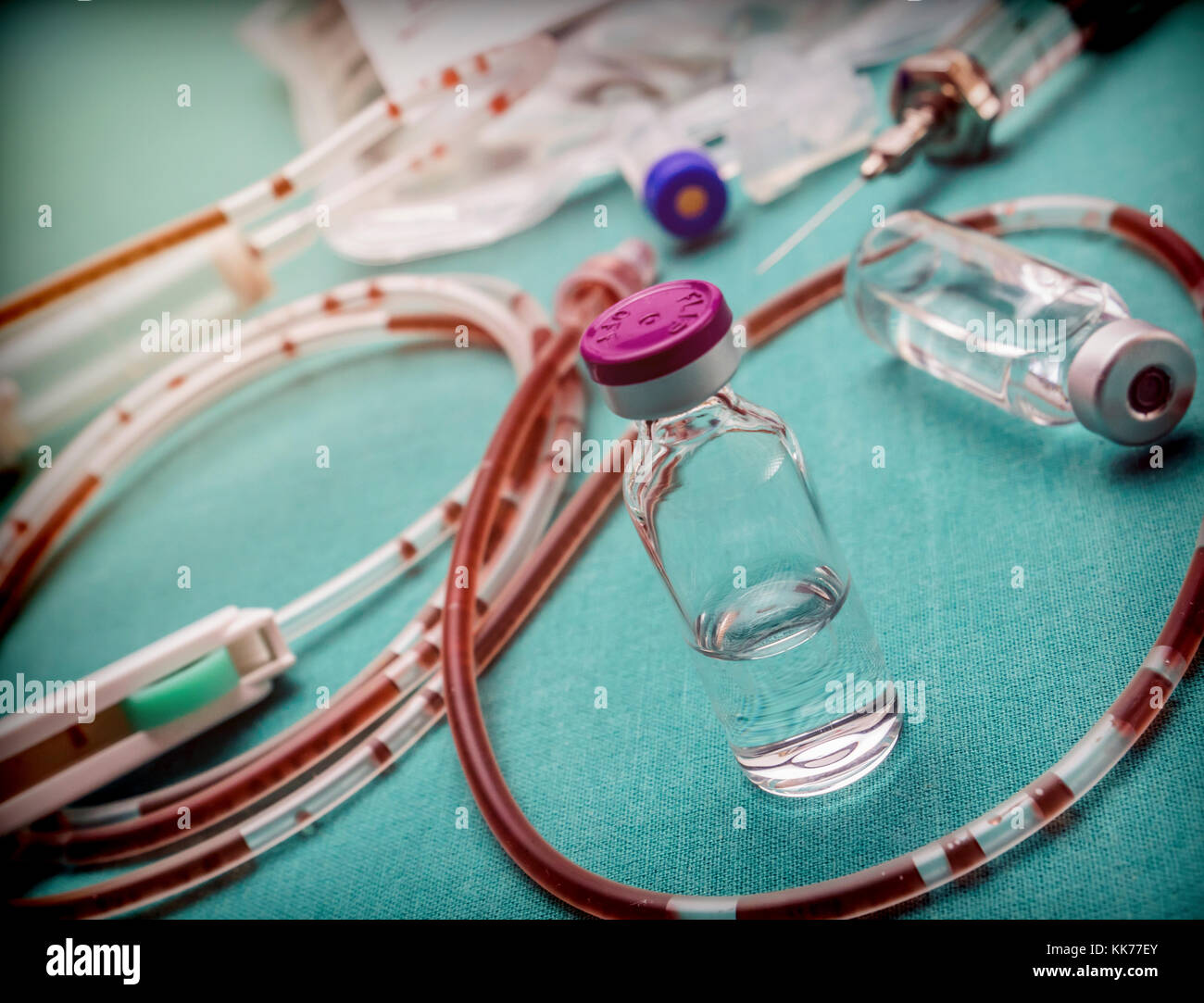 Rubber drip irrigation system with traces of blood along with vial ...