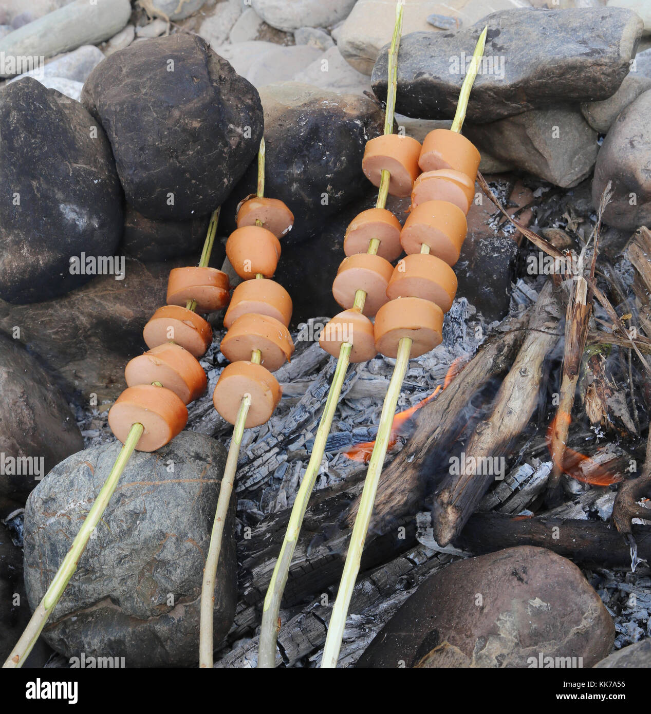 bonfire created with stones for cooking wurstel during boy scout camp ...