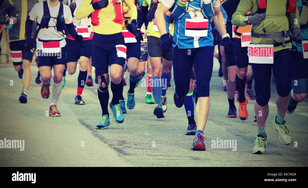 Runners at the end of a marathon running race hi-res stock photography ...
