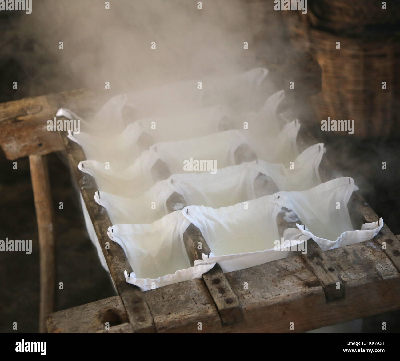 making cheese in a small cheese factory in the mountain hut Stock Photo ...
