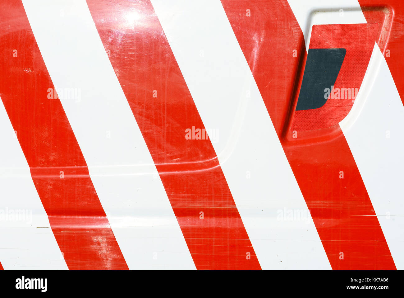 Red and white door markings for safety painted on a vehicle exterior ...