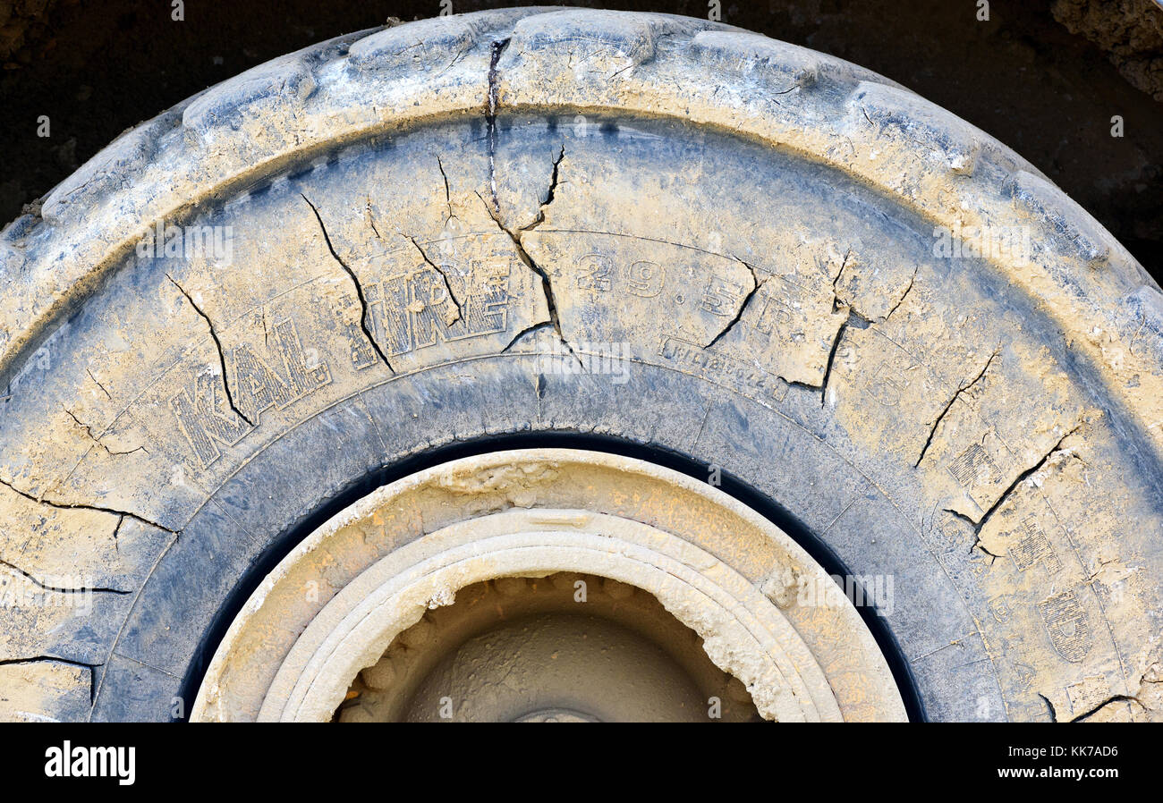 Cracked work tires of a large industrial earthmoving machine with ...