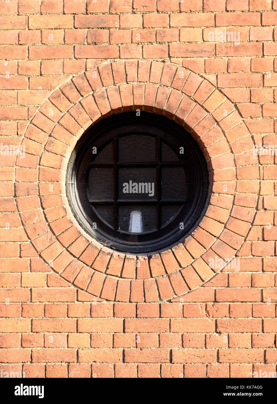 Round window in brick wall hi-res stock photography and images - Alamy