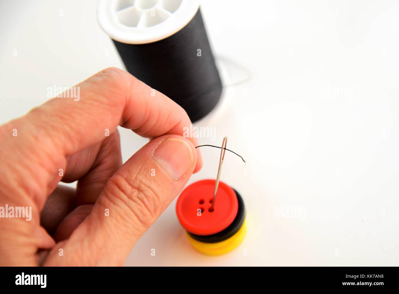 Threading a needle hi-res stock photography and images - Alamy