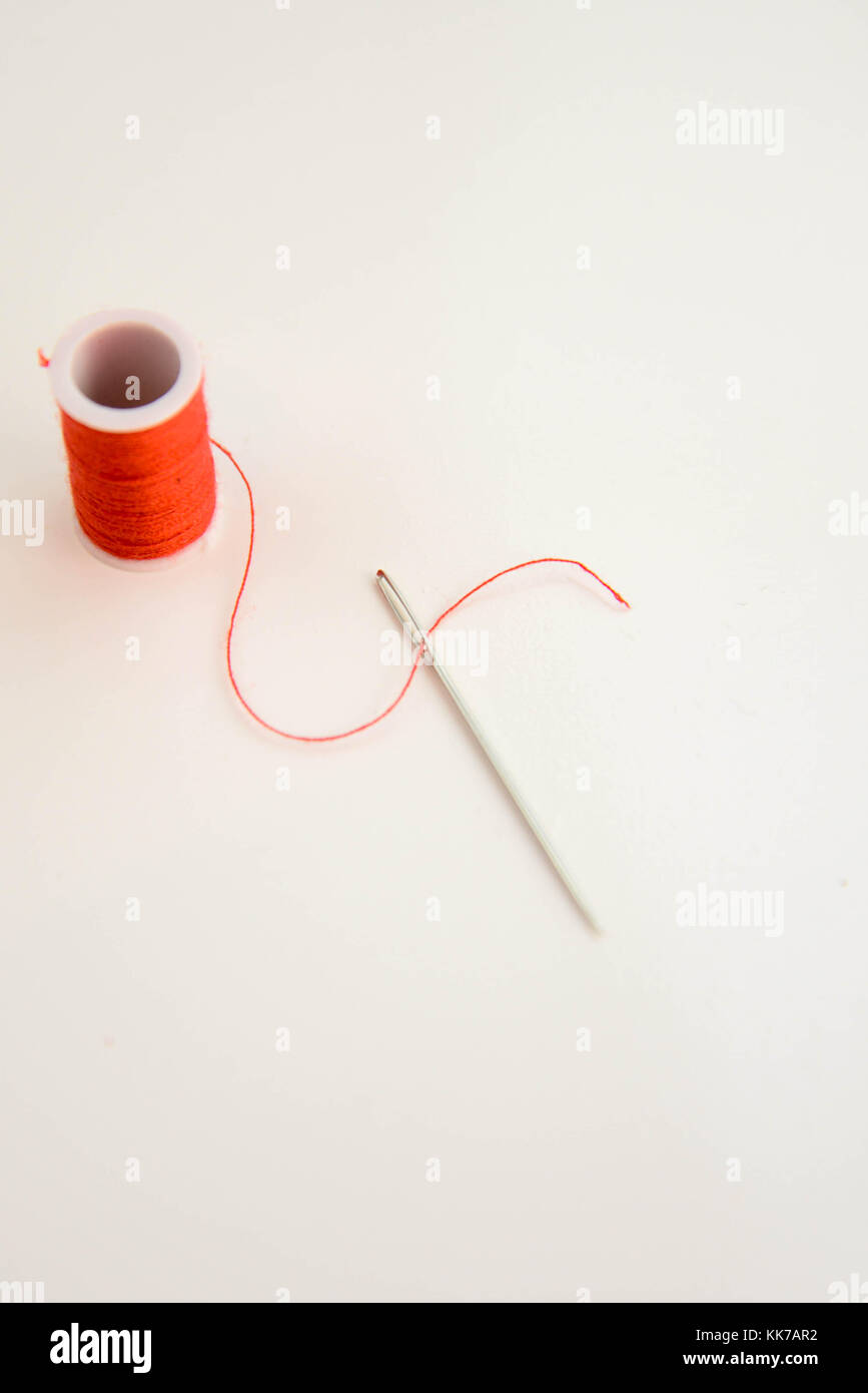Thread through needle hi-res stock photography and images - Alamy