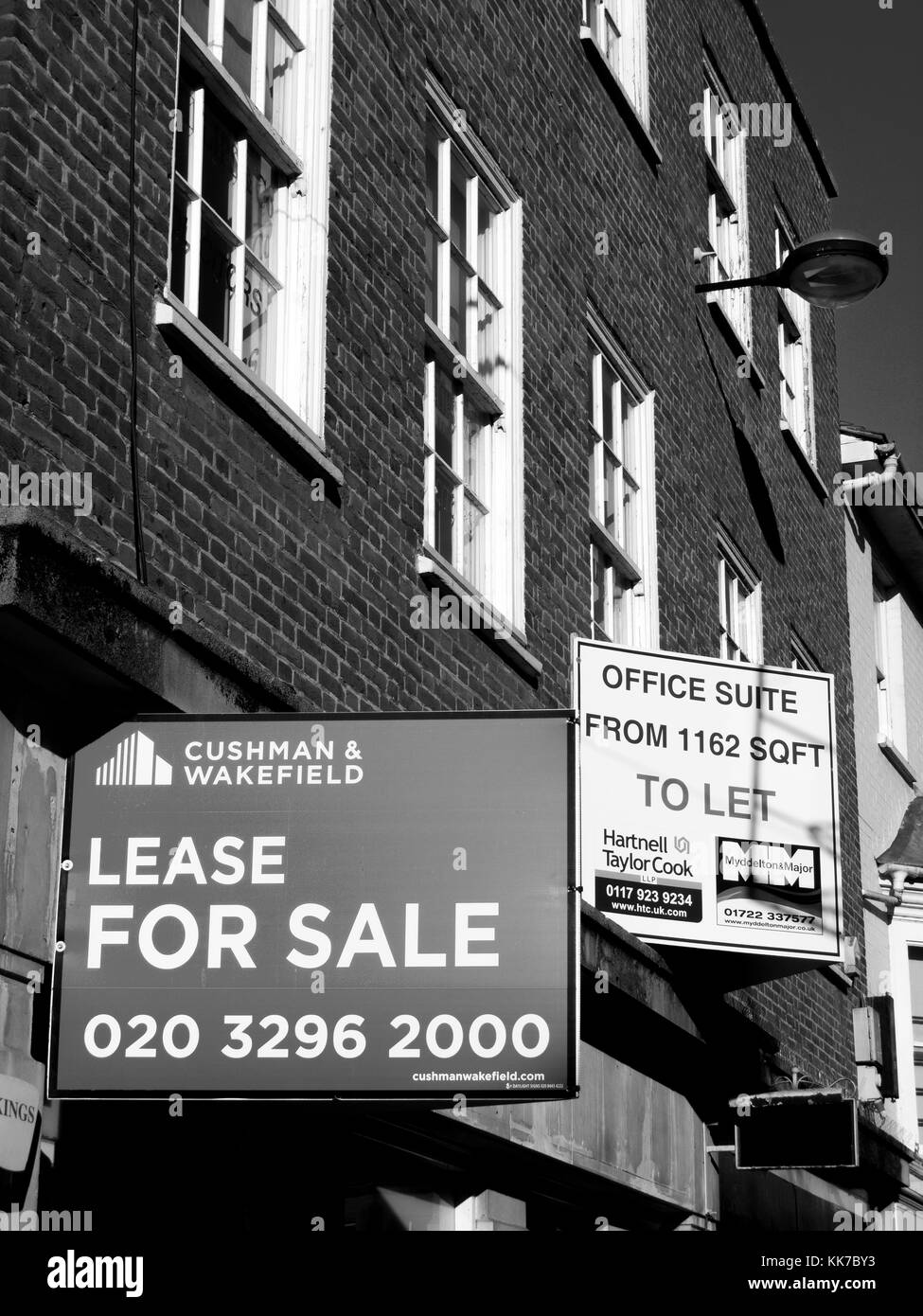 Estate agent advertising signs, retail unit lease for sale over vacant ...