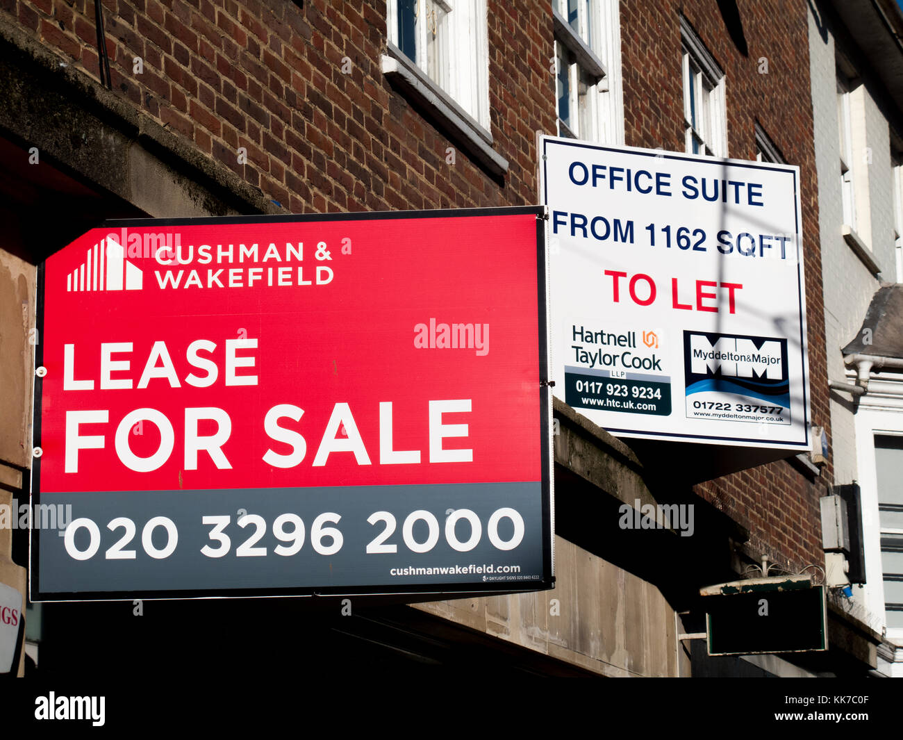 Estate agent advertising signs, retail unit lease for sale over vacant ...