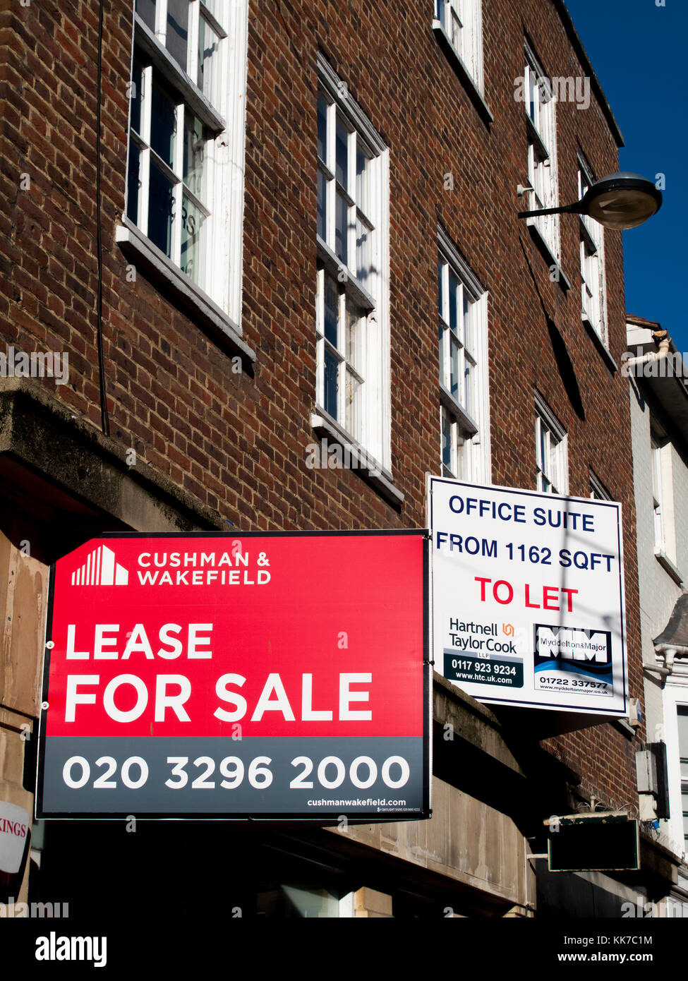 Estate agent advertising signs, retail unit lease for sale over vacant ...