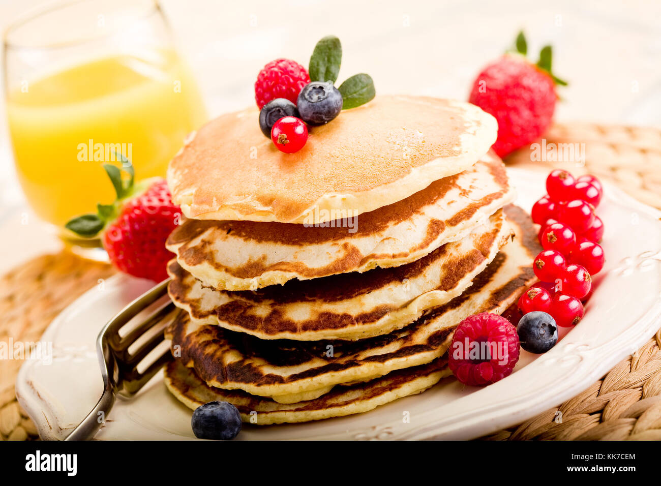 delicious pancakes on morning breakfast table with fruits Stock Photo ...