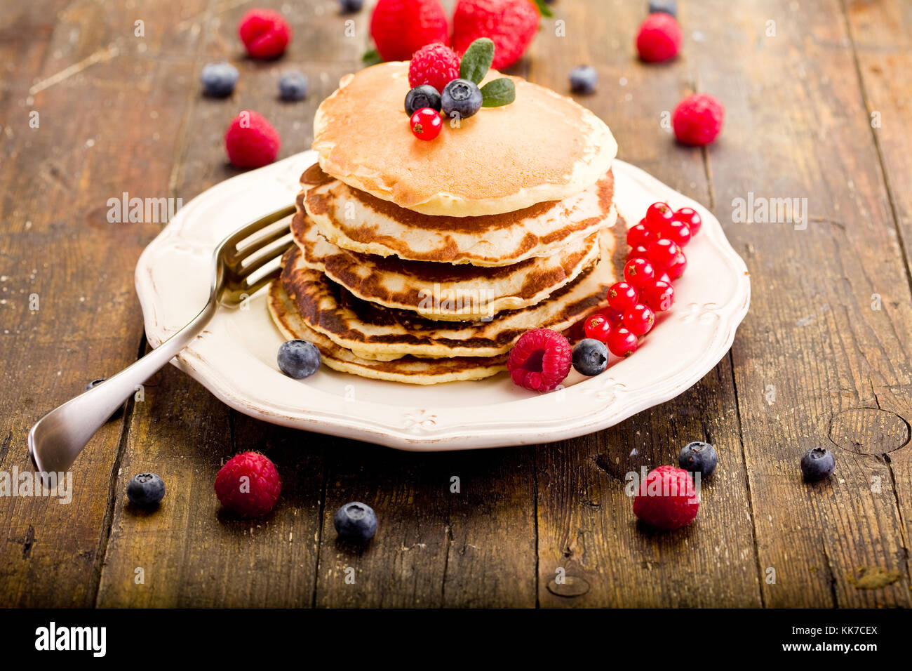 delicious pancakes on wooden table with fruits Stock Photo - Alamy