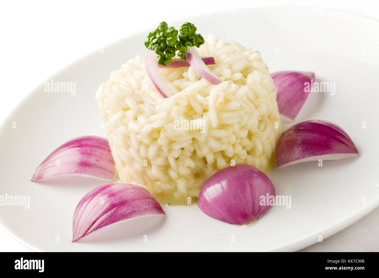 photo of delicious risotto with red onions on white isolated background ...