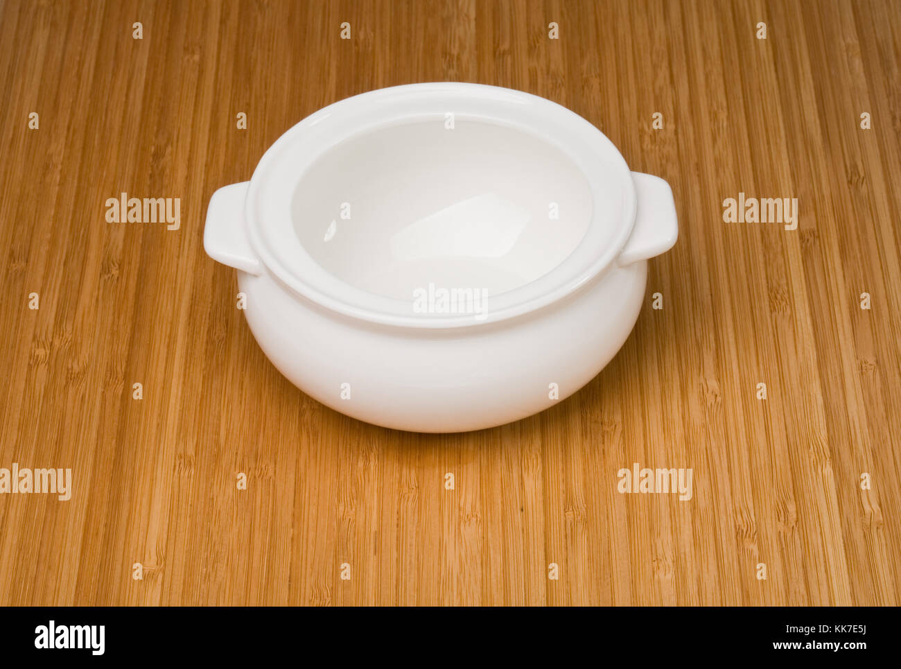 empty white pot on bamboo countertops background Stock Photo - Alamy