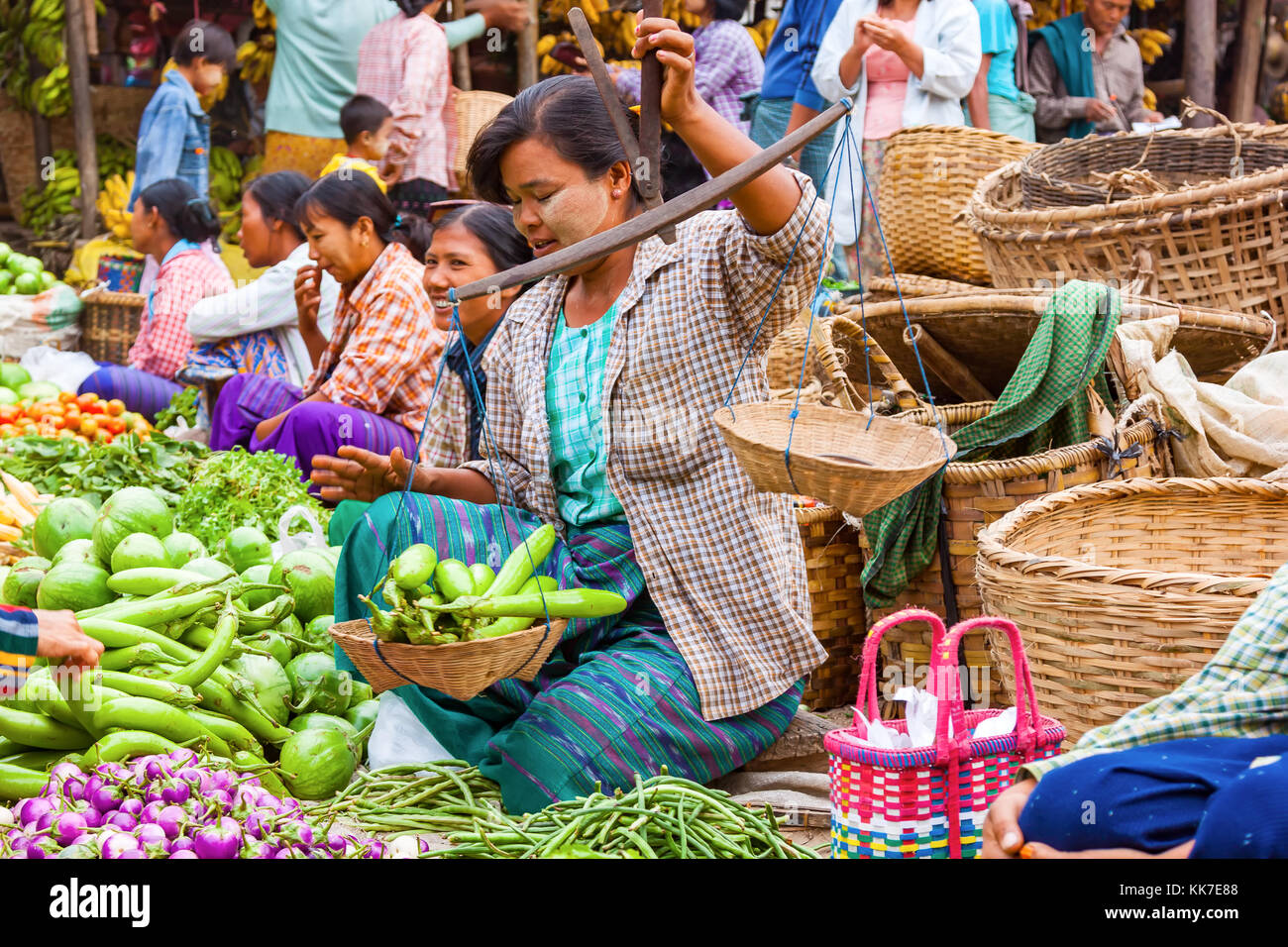 Bagan, Myanmar - Dec 9, 2010 : Burmese woman weighing vegetable at ...