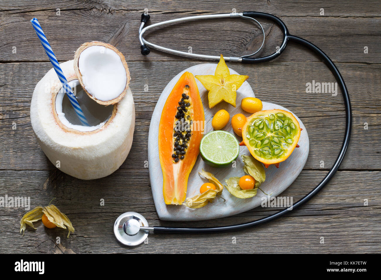 Tropical diet concept with heart coconut milk and stethoscope Stock ...