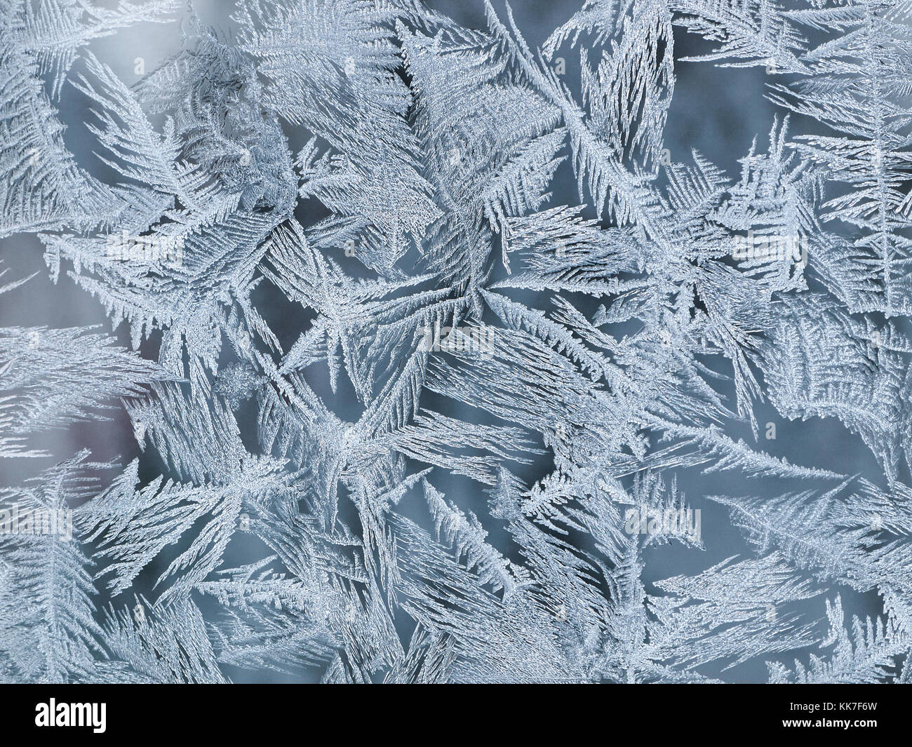 Fancy frozen pattern on the window glass Stock Photo - Alamy