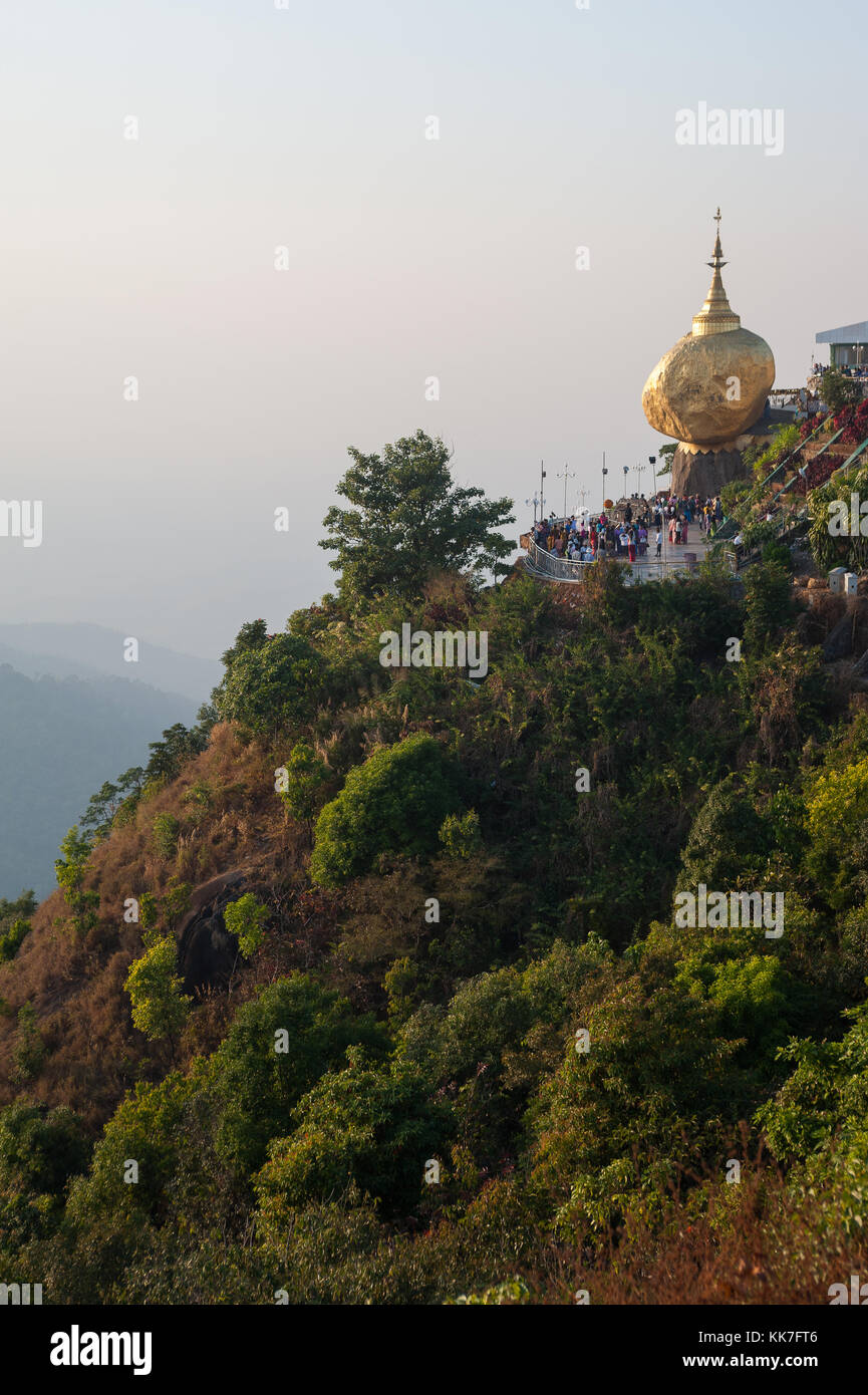 Kyaikto, Myanmar, pilgrim on the Golden Rock with the Kyaiktiyo Pagoda ...