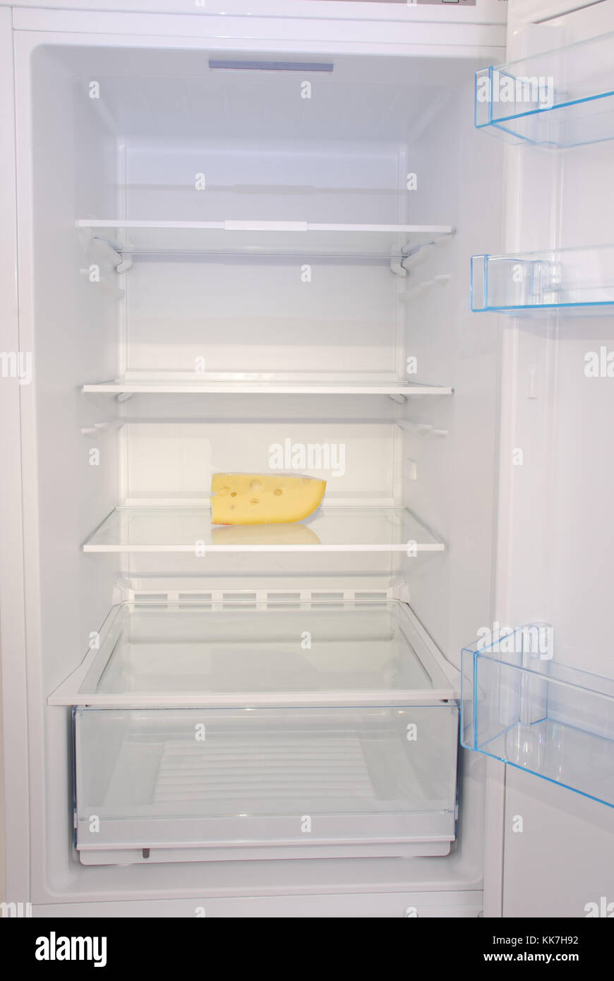 One cheese in open empty refrigerator. Weight loss diet concept Stock ...