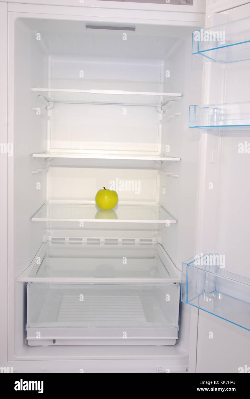 One apple in open empty refrigerator. Weight loss diet concept Stock ...