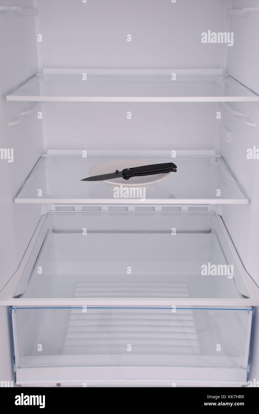 Knife inside in empty clean refrigerator with opened door Stock Photo ...