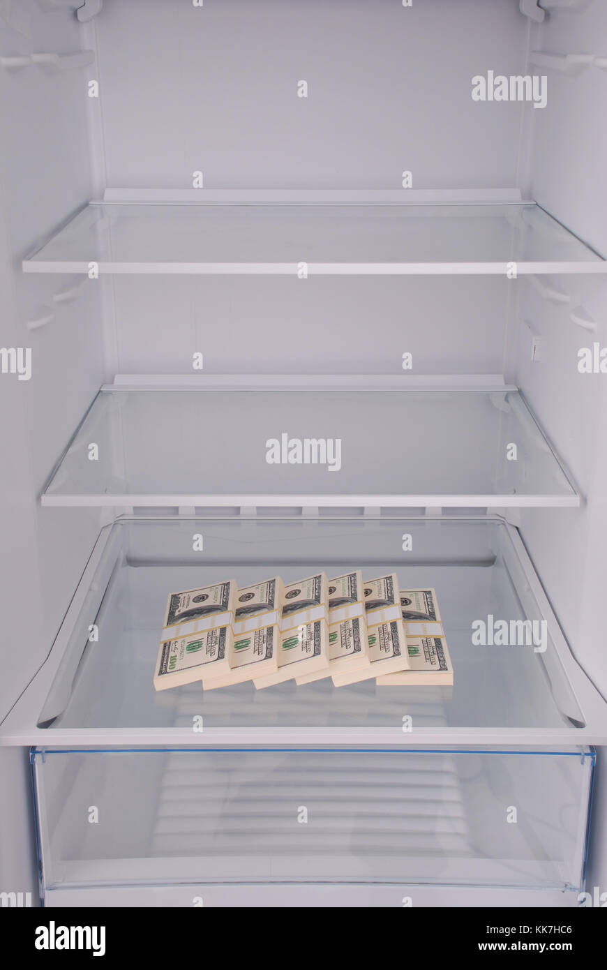 Dollars inside in empty clean refrigerator with opened door Stock Photo ...