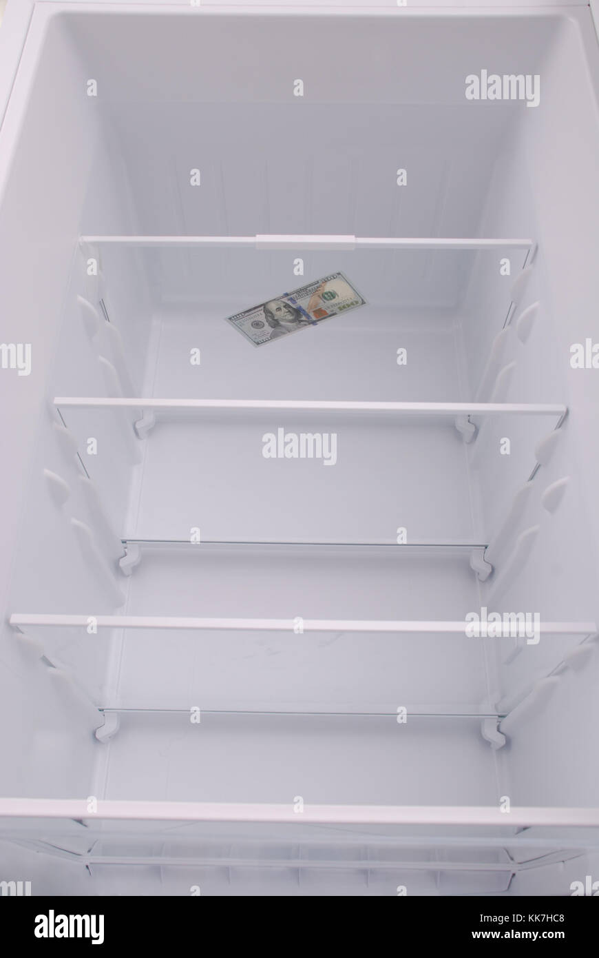 Dollars inside in empty clean refrigerator with opened door Stock Photo ...