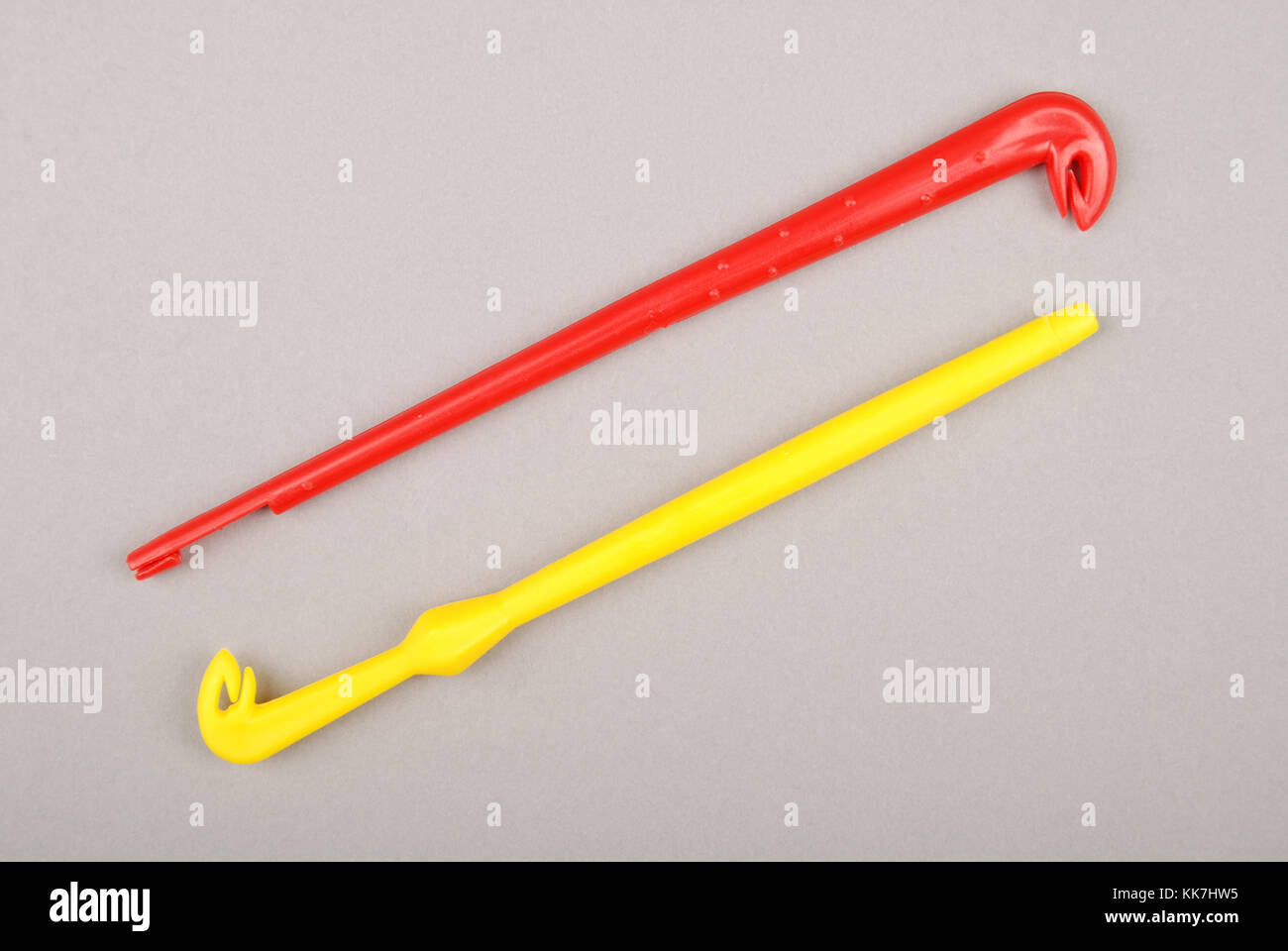 Red and yellow loop tier isolated on gray background Stock Photo - Alamy