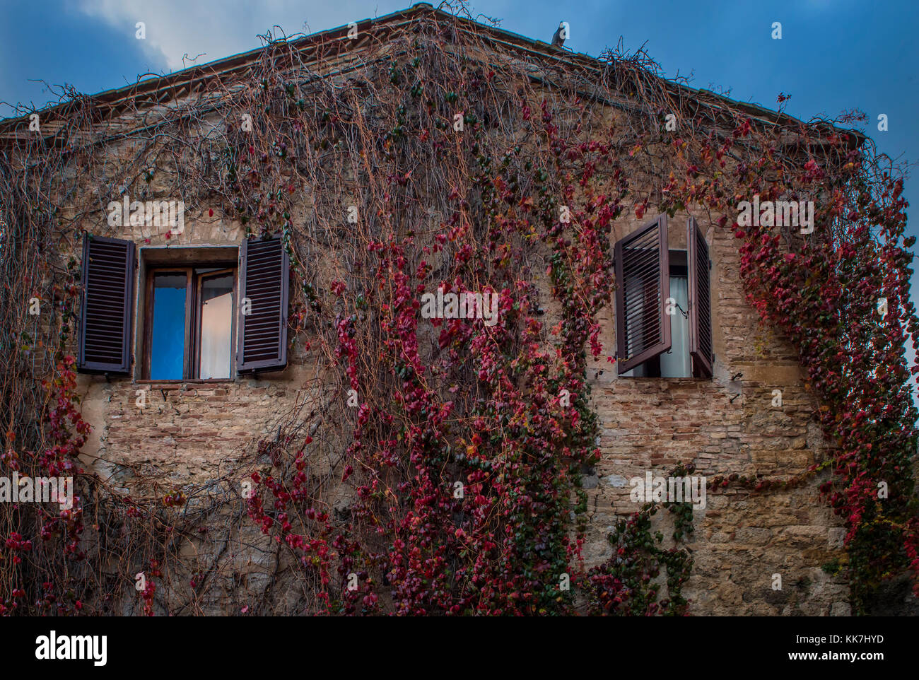old brick house with open windows Stock Photo - Alamy