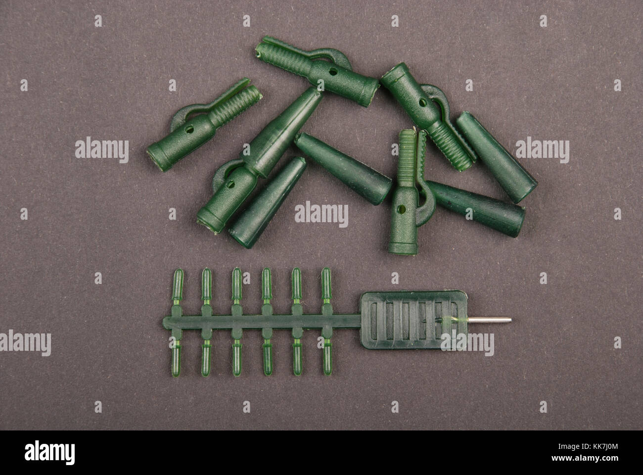 Green safety lead clips isolated on black background Stock Photo - Alamy