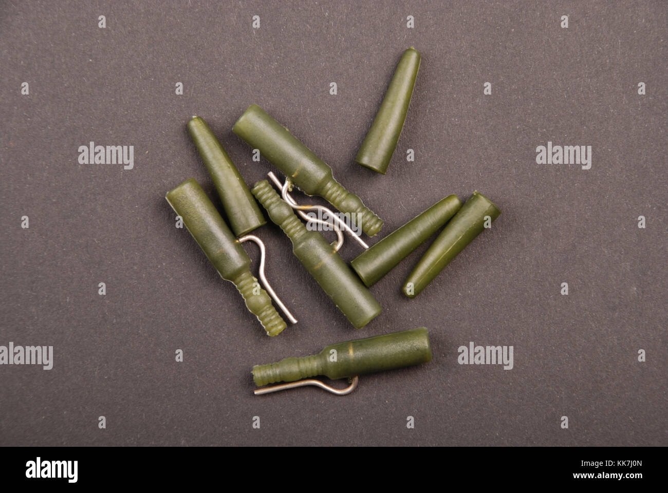 Brown safety lead clips isolated on black background Stock Photo - Alamy