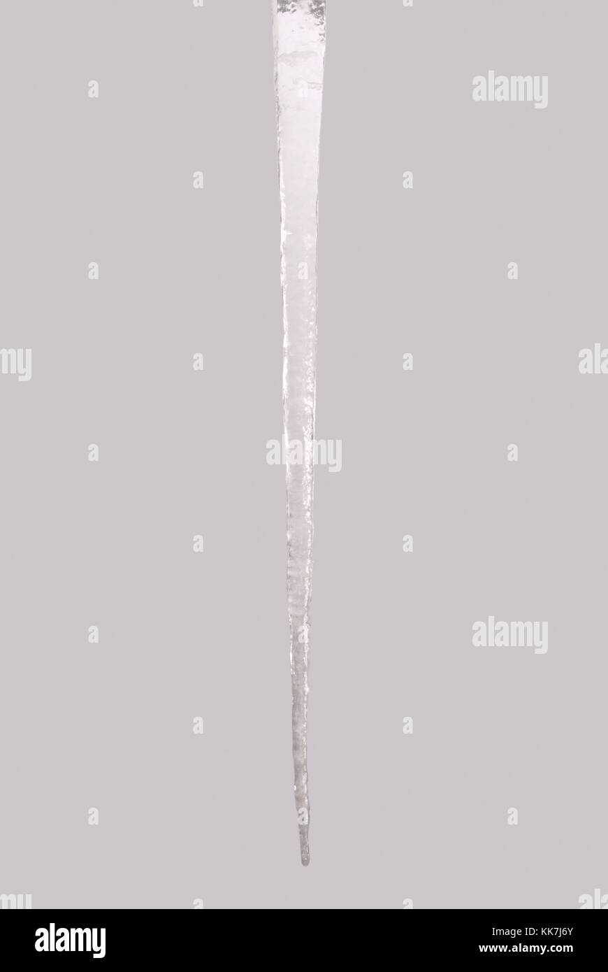 Icicle isolated on a grey background. Frozen water. Clipping path ...