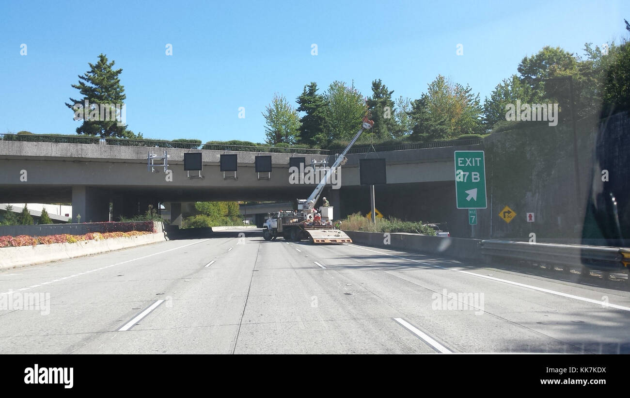 Contractor crews install new electronic signs on eastbound I-90 near ...