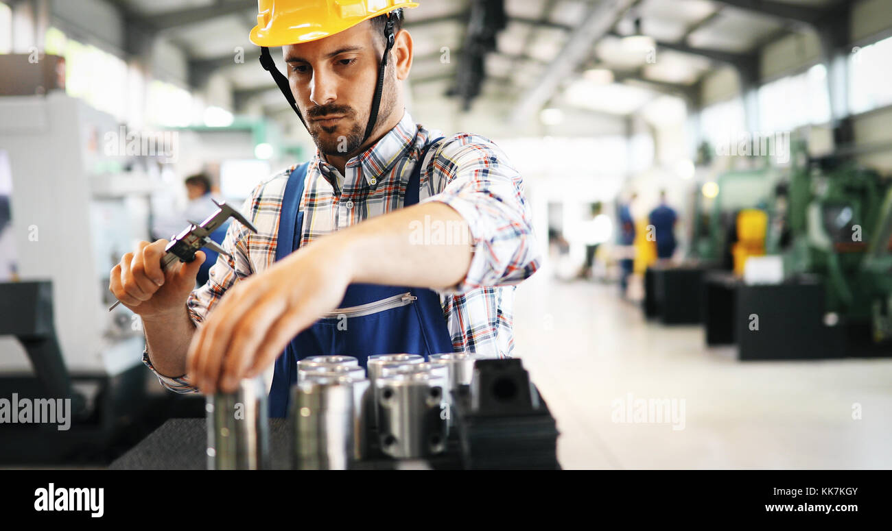 Male worker and quality control inspection in factory Stock Photo - Alamy