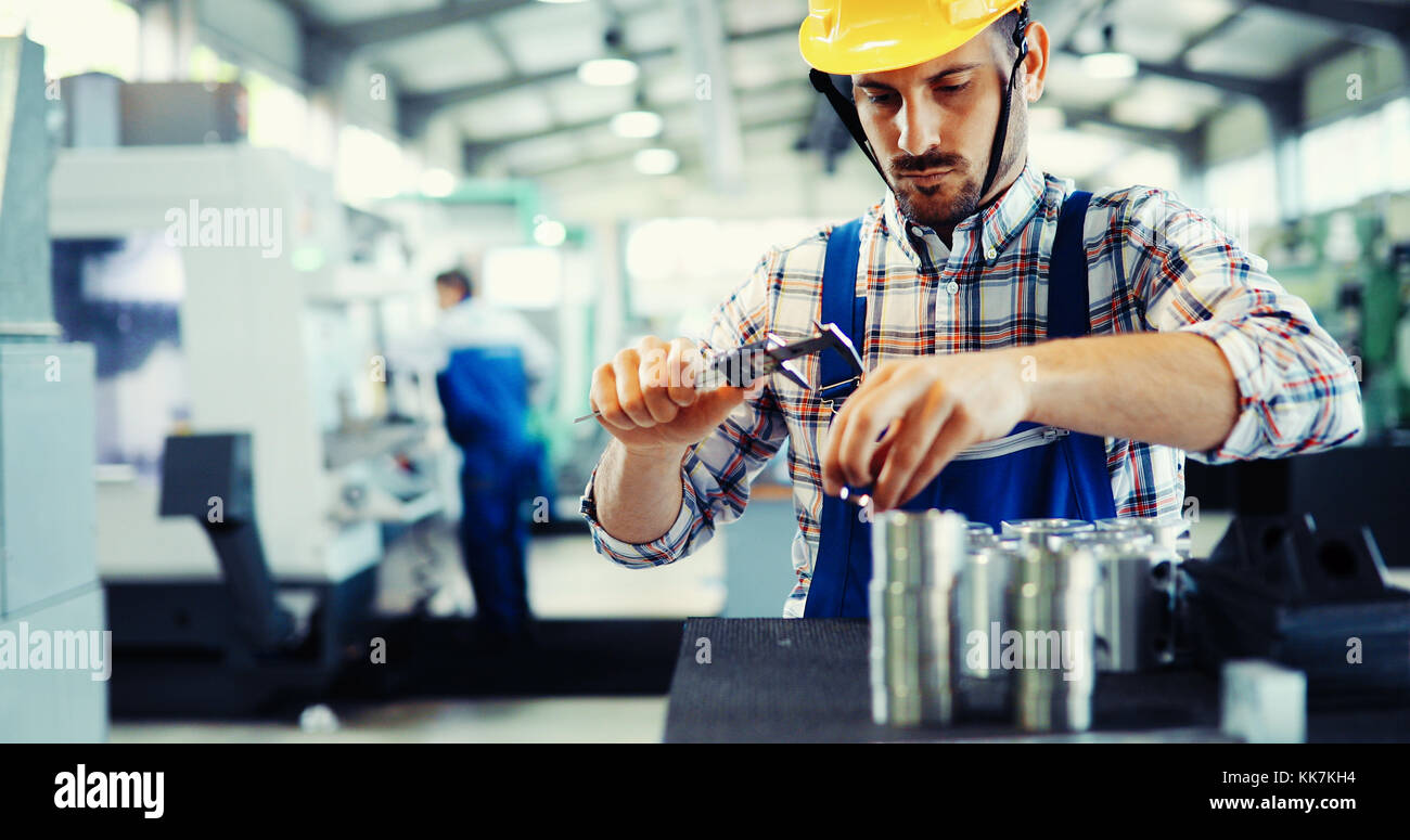 Male worker and quality control inspection in factory Stock Photo - Alamy
