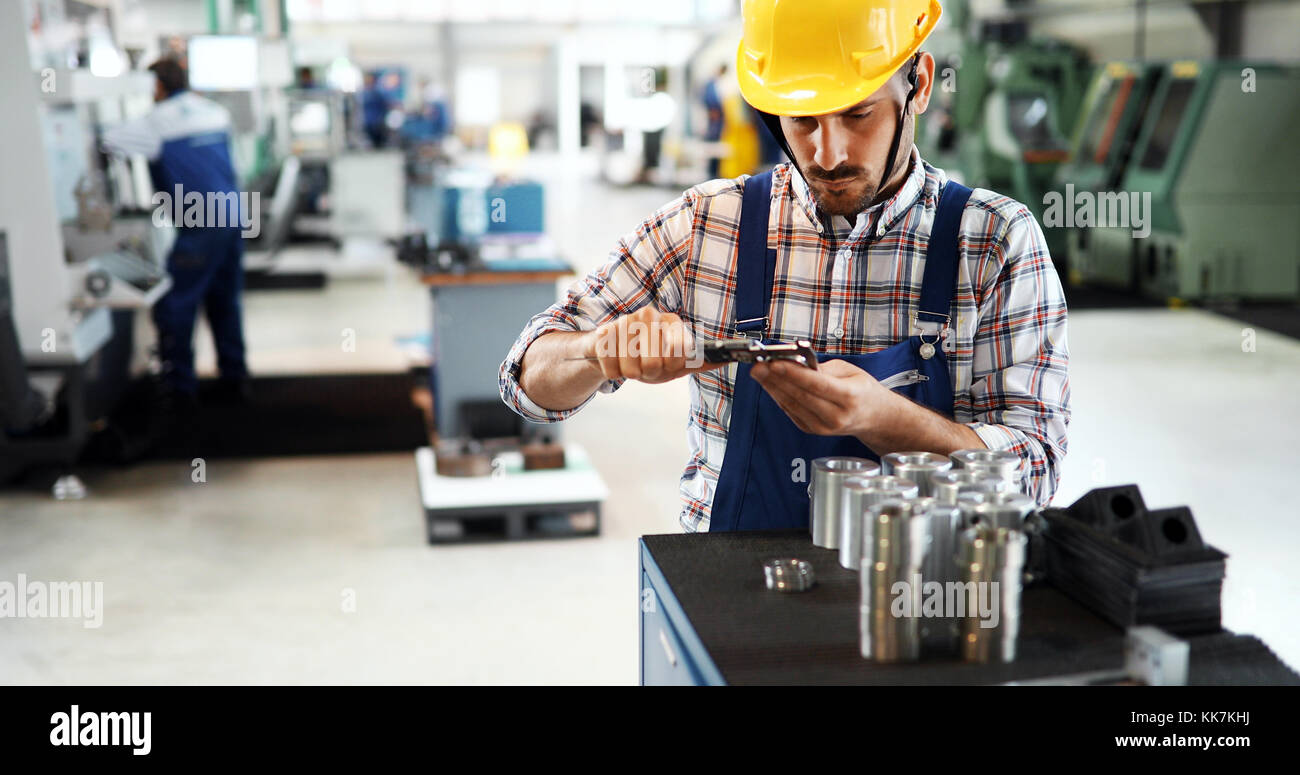 modern industrial machine operator working in factory Stock Photo - Alamy
