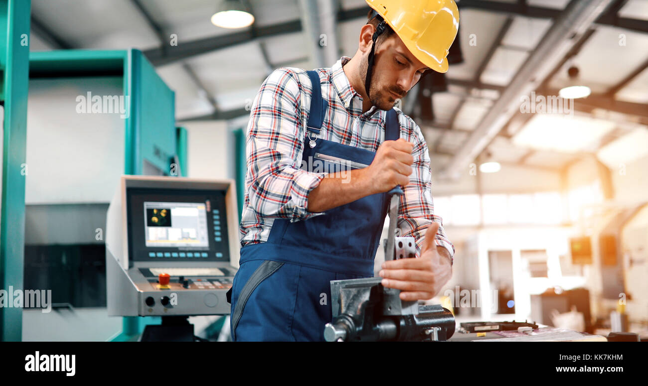 Male worker and quality control inspection in factory Stock Photo - Alamy