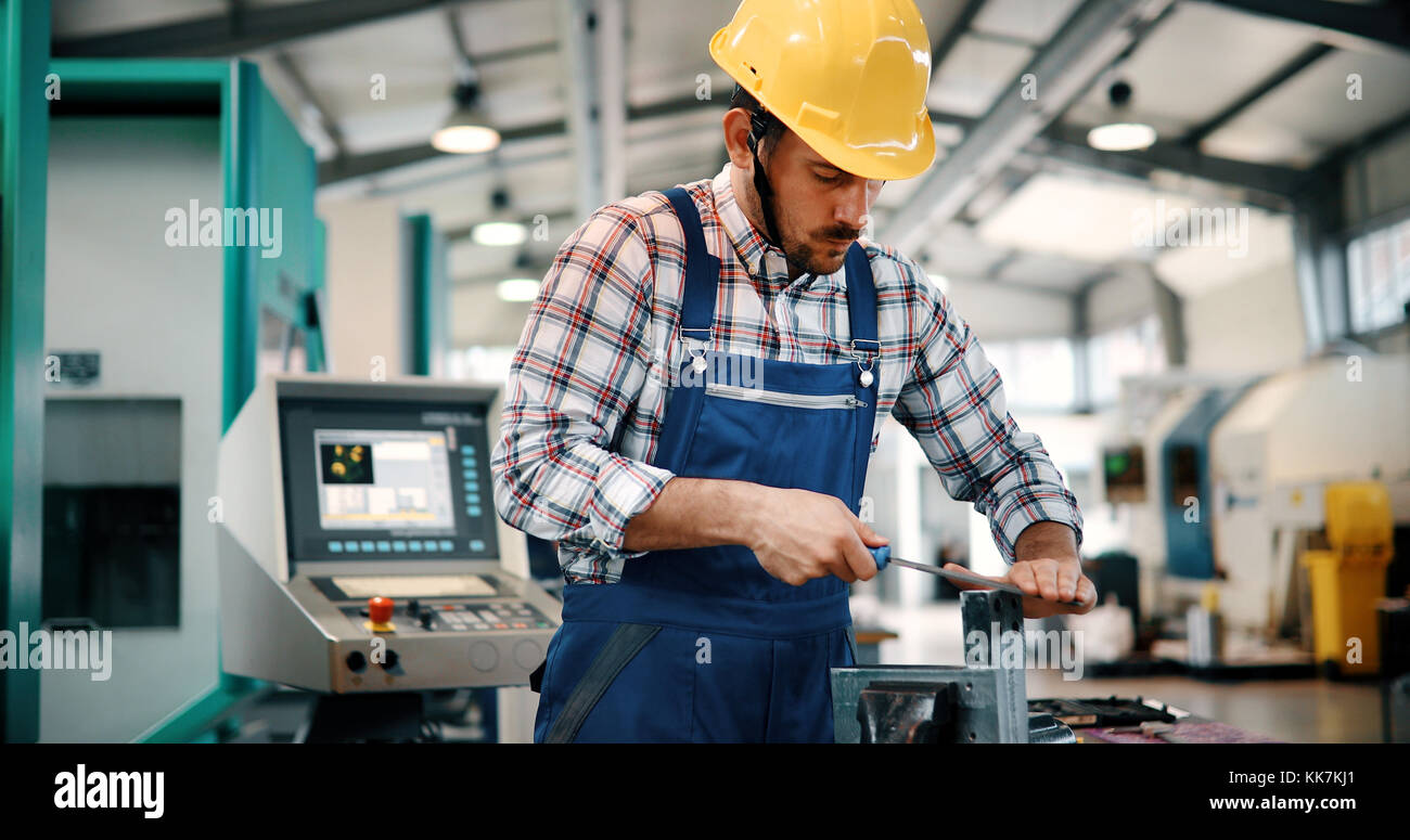 modern industrial machine operator working in factory Stock Photo - Alamy