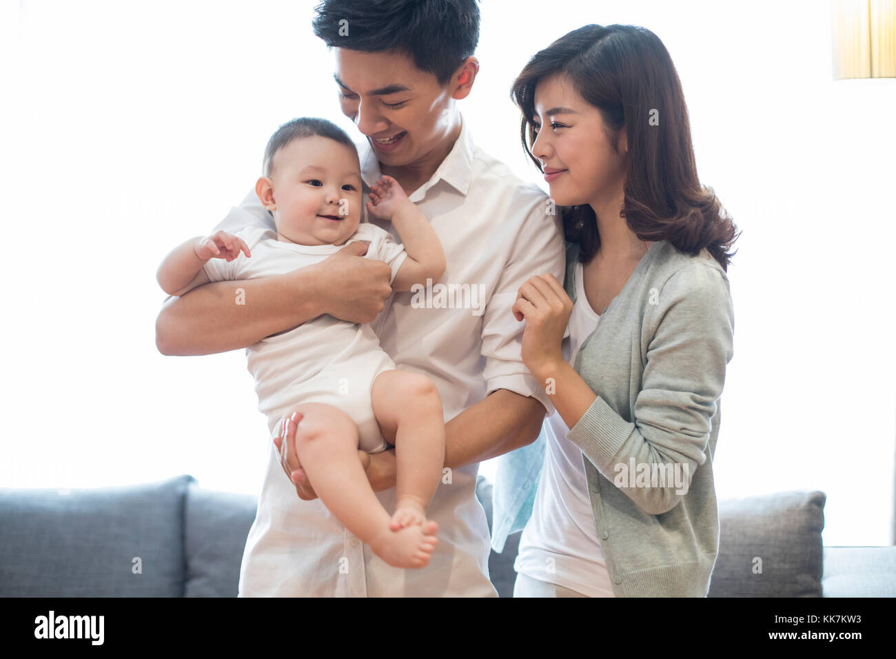 Happy young Chinese family Stock Photo - Alamy