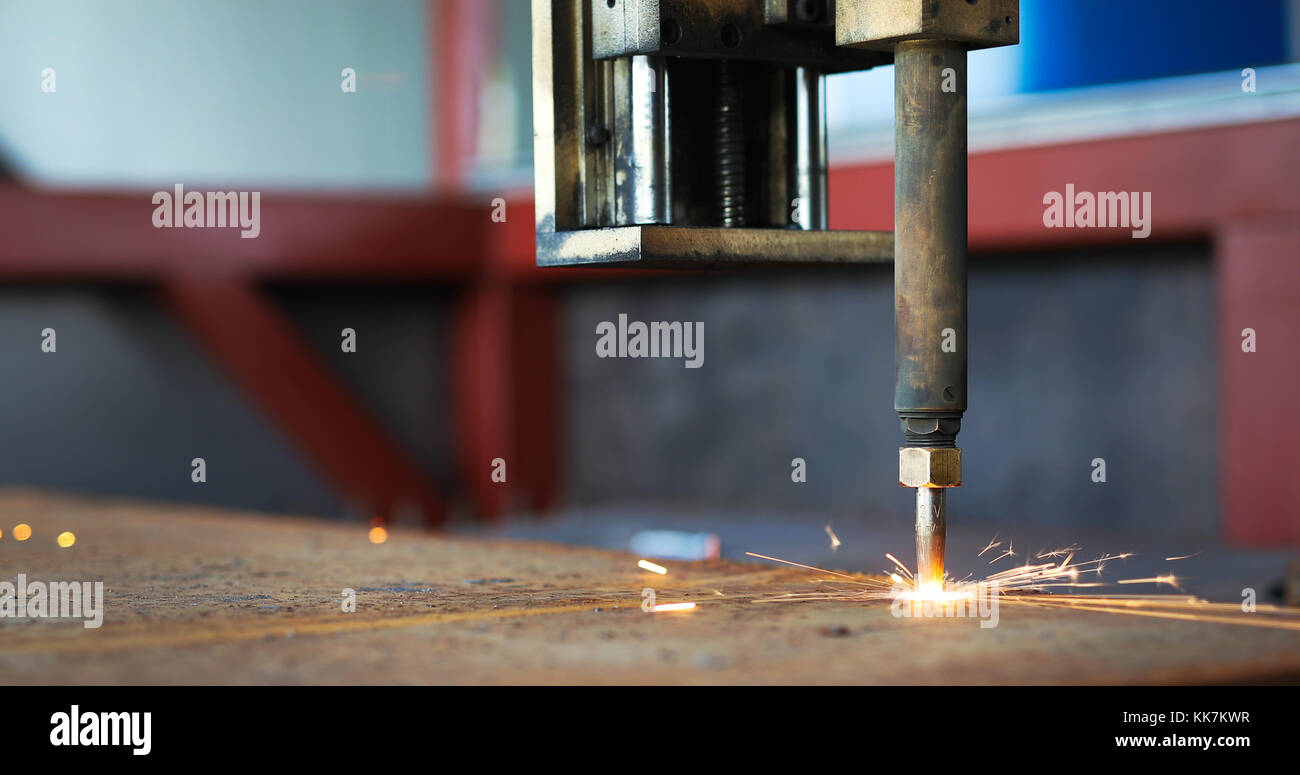 Oxygen torch cuts steel sheet. CNC gas cutting machine. Bright sparks ...