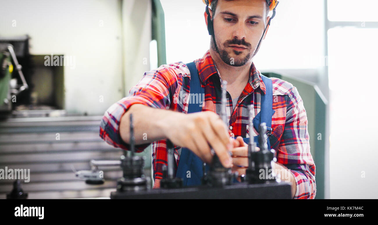 modern industrial machine operator working in factory Stock Photo - Alamy