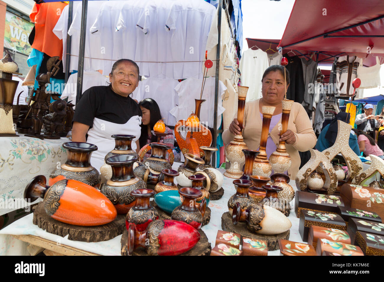 Ecuador Otavalo market - craft market stall and two indigenous women ...