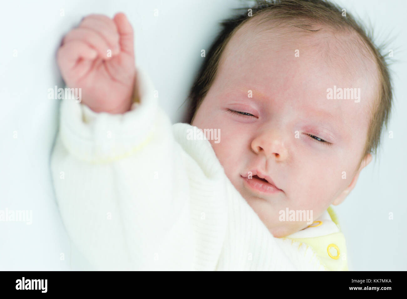 Newborn baby less than month age sleeping Stock Photo - Alamy