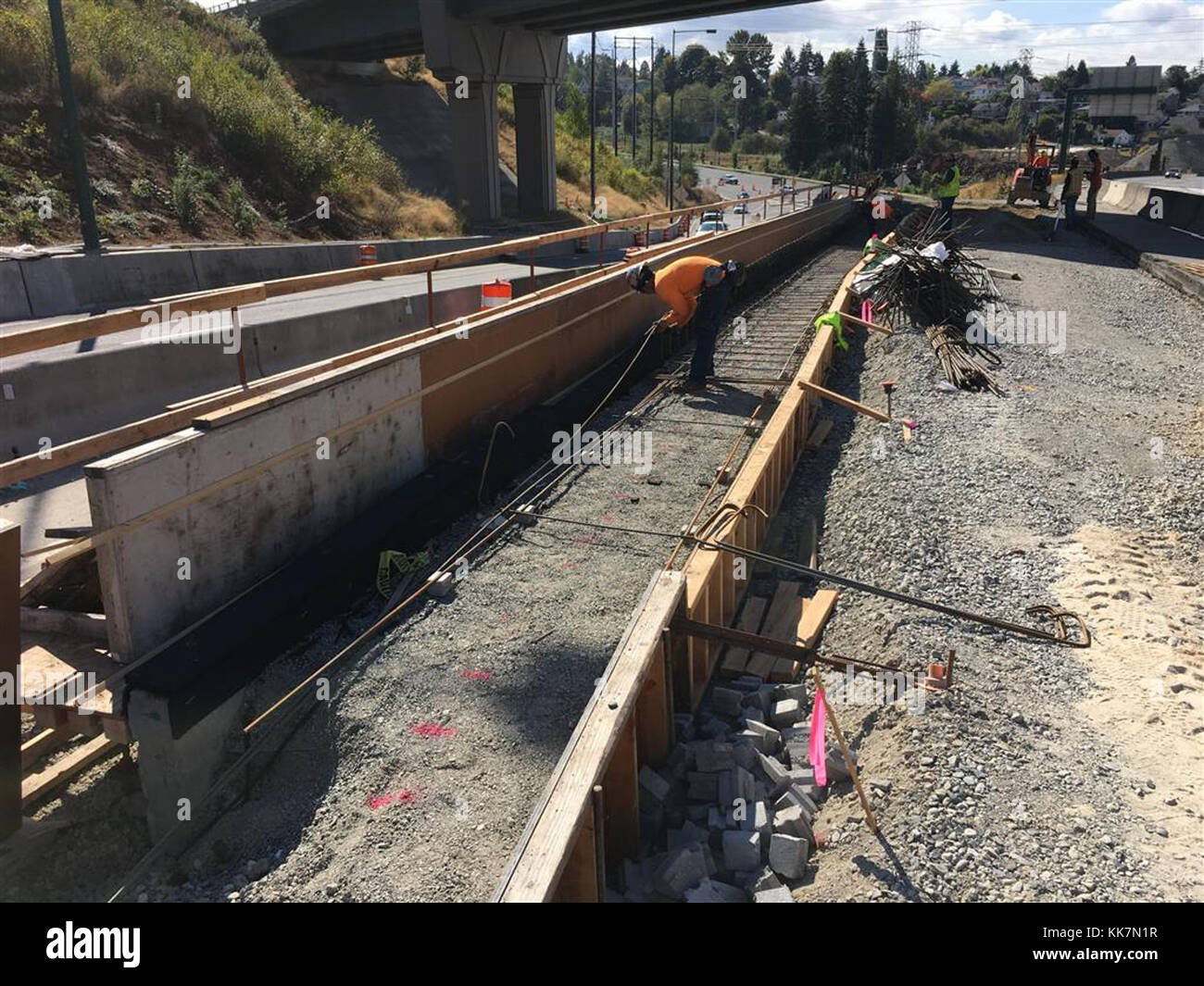 Crews tie reinforcement bar (rebar) for barrier moment slab on the ...