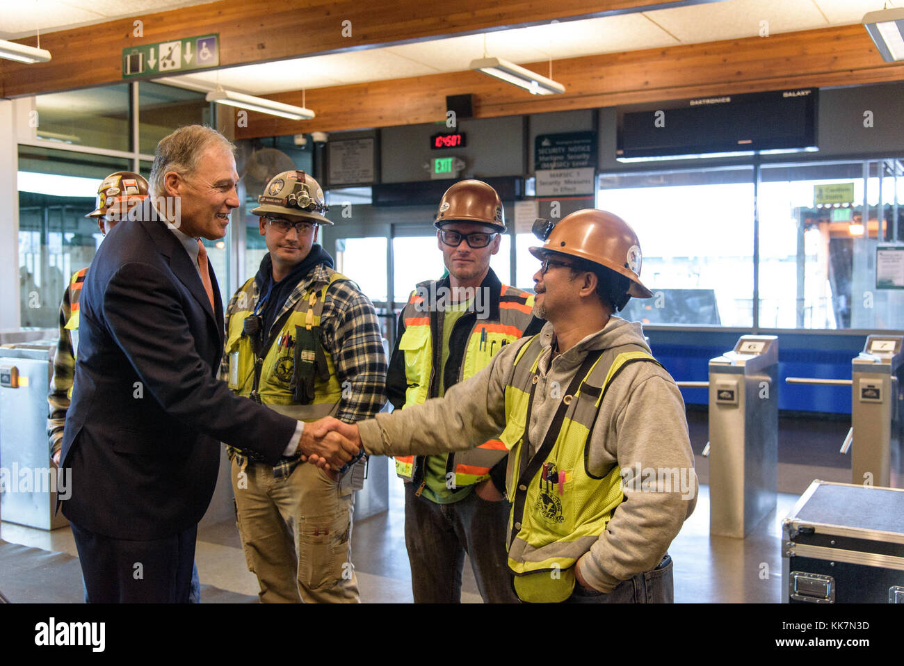 October 2017: Governor Jay Inslee shakes hands with four Colman Dock ...
