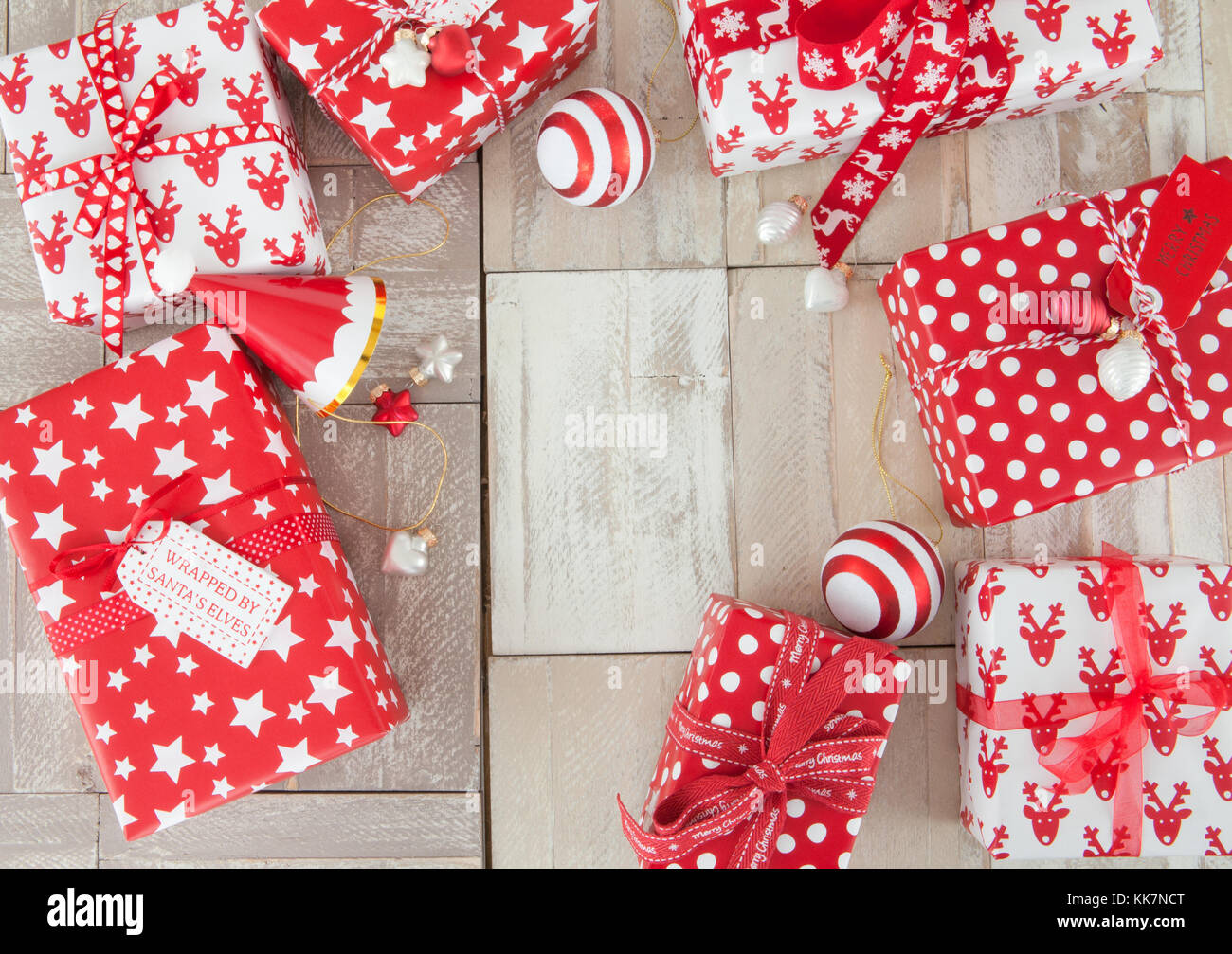 Christmas presents in red and white wrapping paper Stock Photo - Alamy
