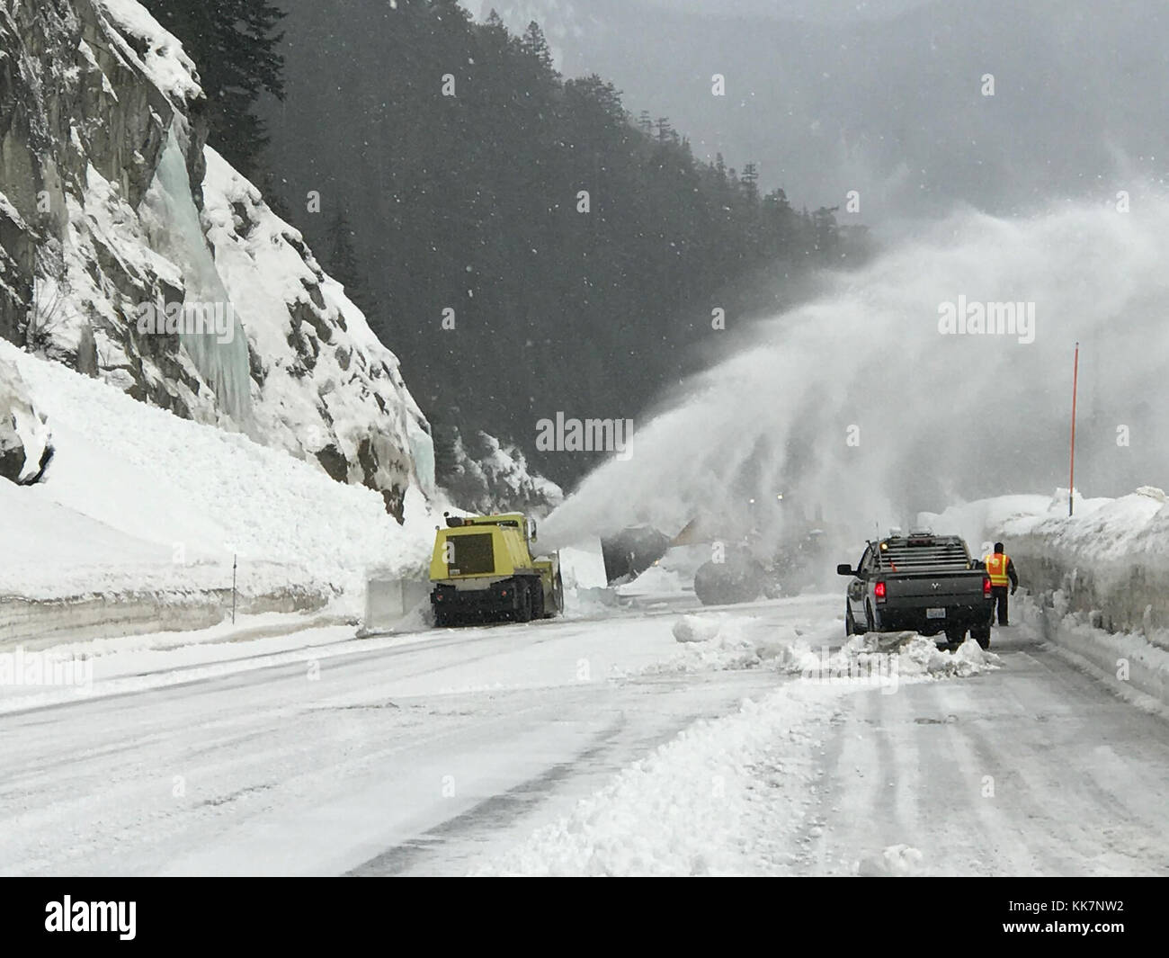 A snow blower sends snow flying through the air during clearing efforts ...